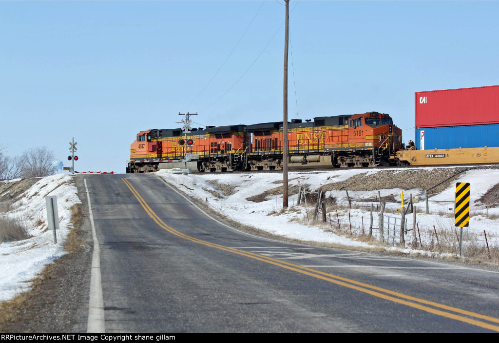 BNSF 4517 Leads a Wb stack train past the hwy 156 crossing.